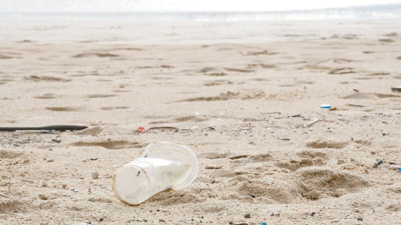 Garbage on sand beach stock photo. Image of dirty, plastic - 187481046