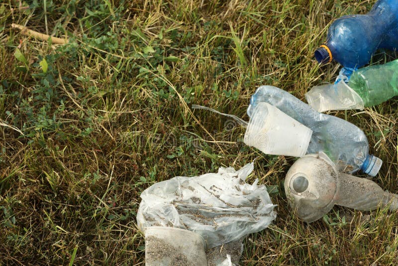 Garbage Scattered on Grass. Environment Pollution Problem Stock Image ... Garbage Scattered on Grass. Environment Pollution Problem Stock Image ...