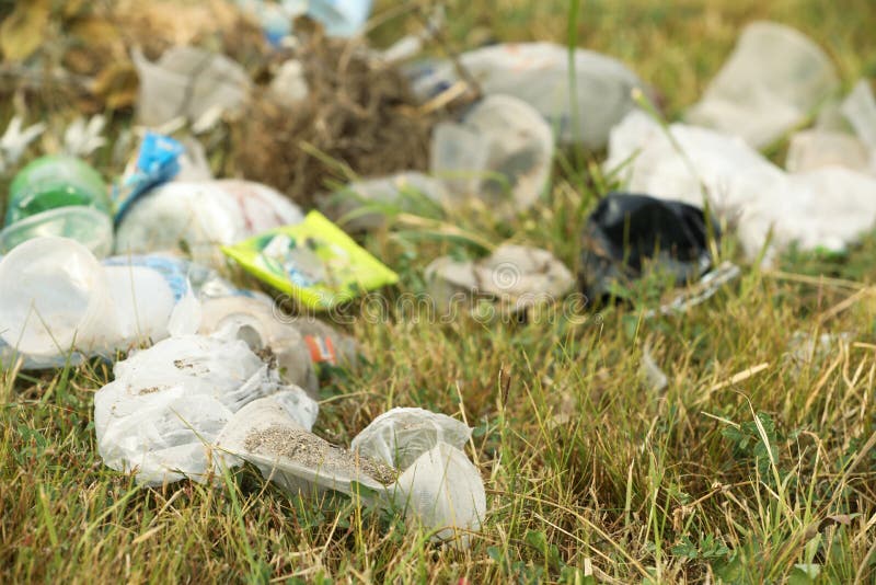Garbage Scattered on Grass. Environment Pollution Problem Stock Photo ...