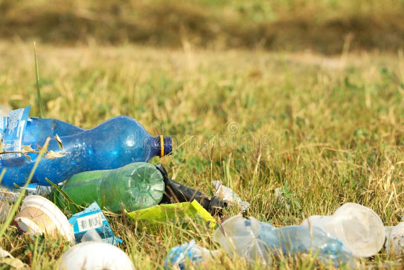 Garbage Scattered on Grass. Environment Pollution Problem Stock Image ...