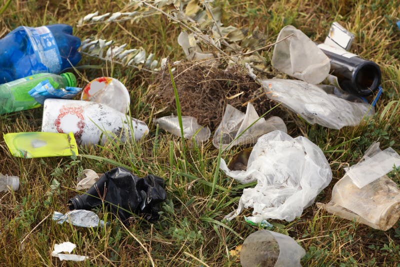 Garbage Scattered on Grass. Environment Pollution Problem Stock Image ... Garbage Scattered on Grass. Environment Pollution Problem Stock Image ...