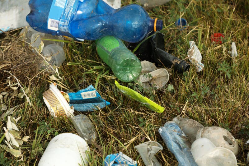 Garbage Scattered on Grass. Environment Pollution Problem Stock Image ... Garbage Scattered on Grass. Environment Pollution Problem Stock Image ...