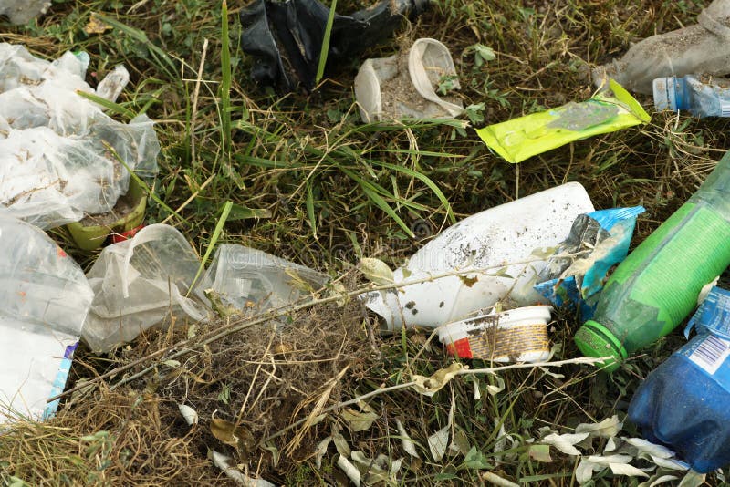 Garbage Scattered on Grass. Environment Pollution Problem Stock Photo ...