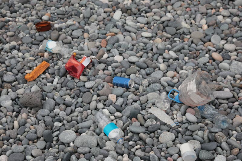 Garbage Scattered on Pebbles Outdoors. Recycling Problem Stock Photo ...