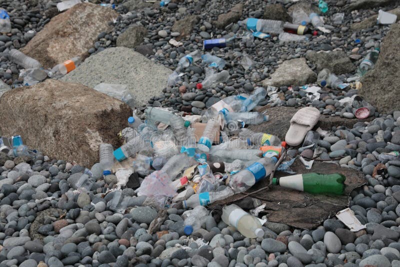 Garbage Scattered on Pebbles Outdoors. Recycling Problem Stock Photo ...