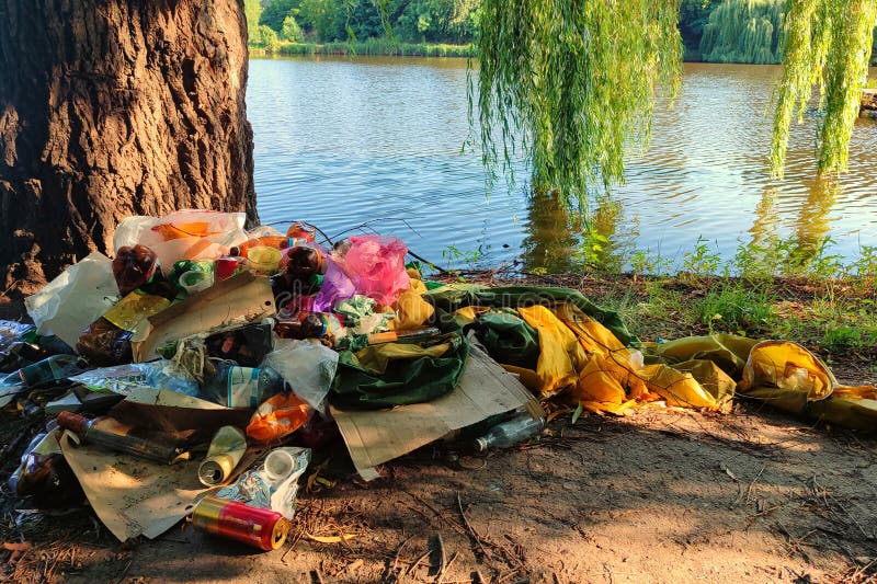 Garbage on the Shore of the Lake. Garbage Dump in Pond Stock Photo ...