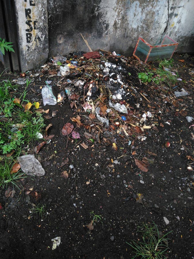 Garbage Strewn Along the Wall Stock Image - Image of garden ...