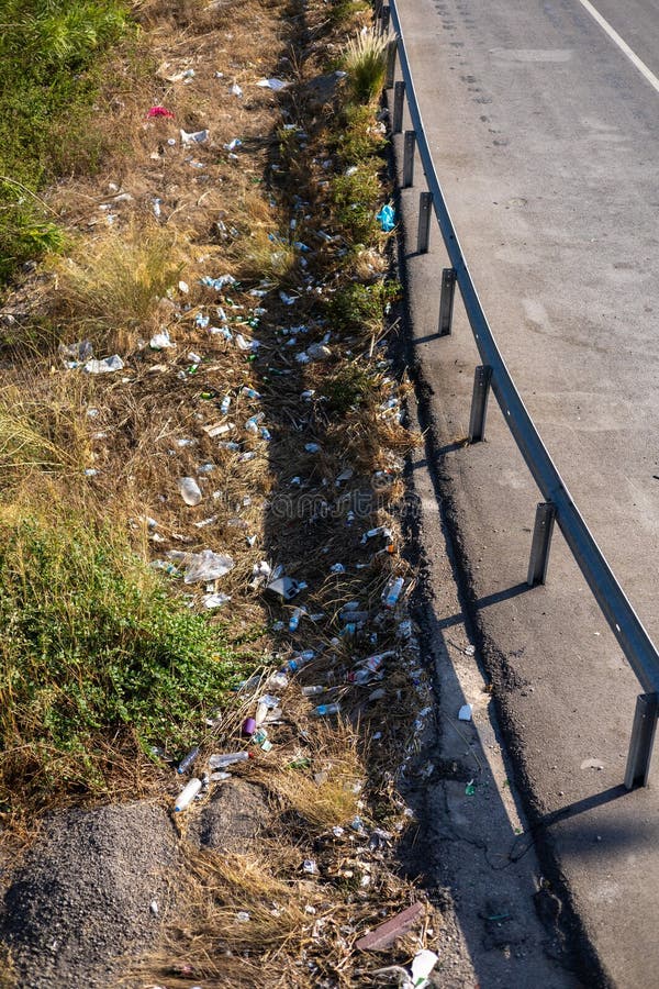 Garbage Thrown on the Side of the Highway. Stock Photo - Image of ...