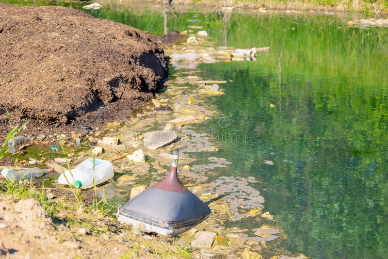 Garbage in the water stock image. Image of reflection - 230931889