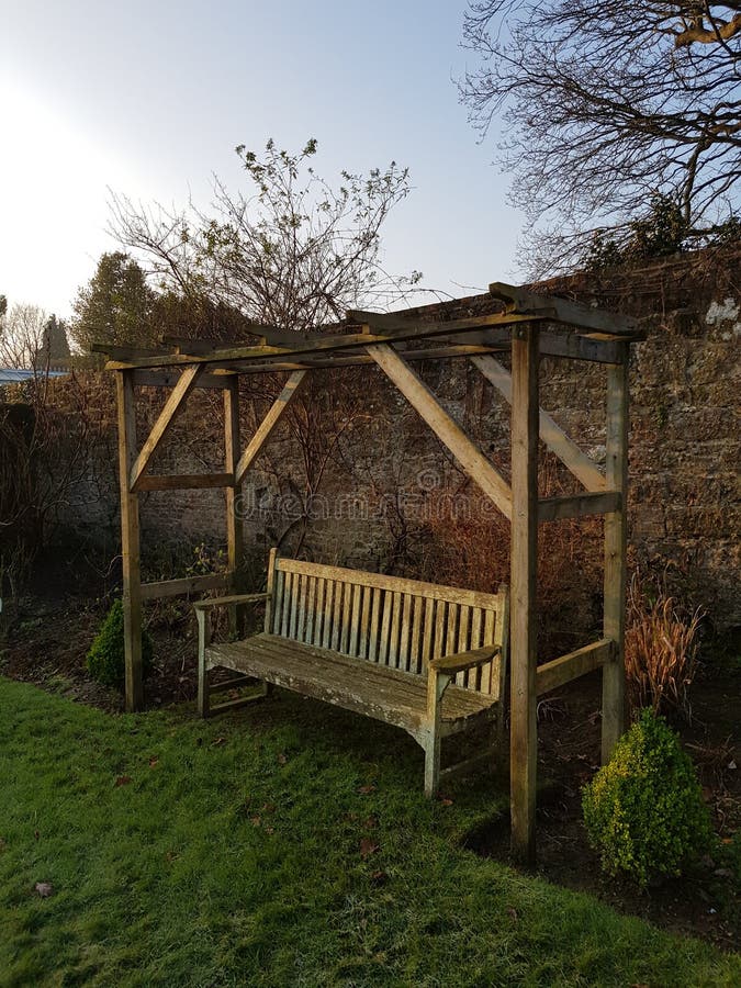 Garden arbor with bench. stock image. Image of park - 110484231