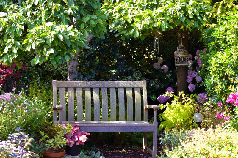 Garden Bench in Spring Bloom Stock Image - Image of garden, bloom: 57964979