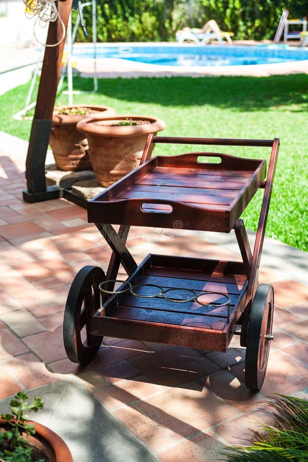 Garden Cart and Swimming Pool Stock Image - Image of outdoors, backyard ...