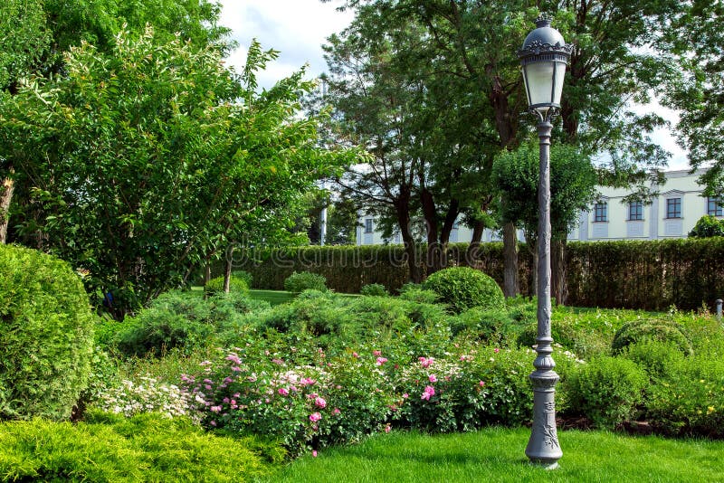 Garden Courtyard with a Post of Lighting and a Lantern in Retro Style ...