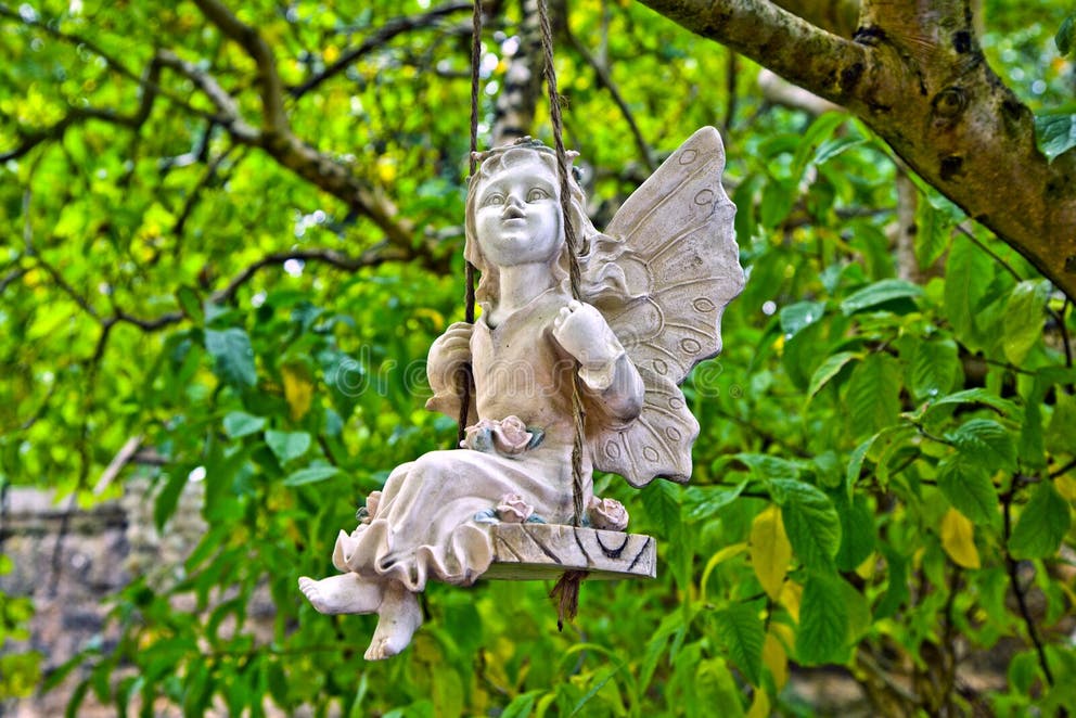 Garden Decoration - an Angel on a Swing Stock Photo - Image of outside ...