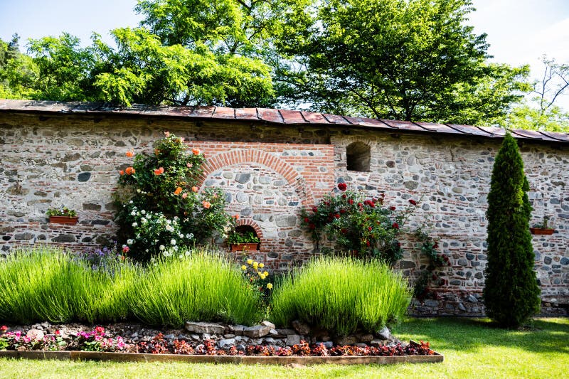 Garden with Different Flowers of the Cornet Monastery on the Olt Valley ...