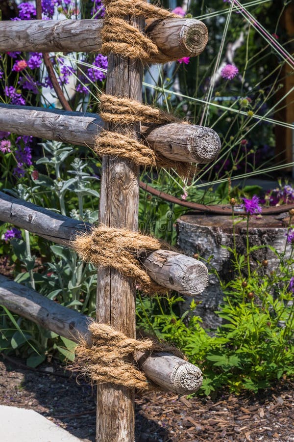 Garden Fence Made of Wooden Posts and Ropes Stock Photo - Image of line ...