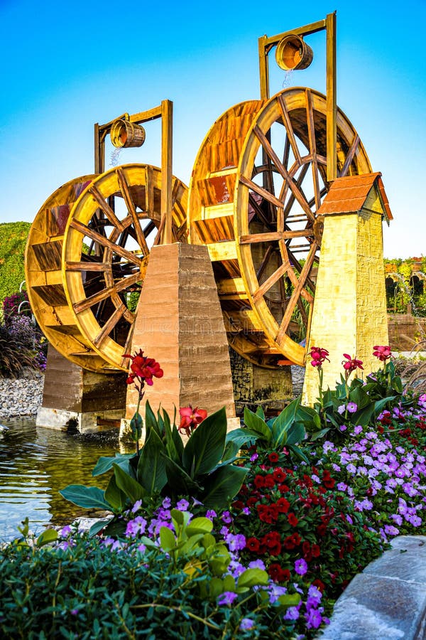 A Garden with Flowers and Water Wheels Stock Image - Image of fair ...
