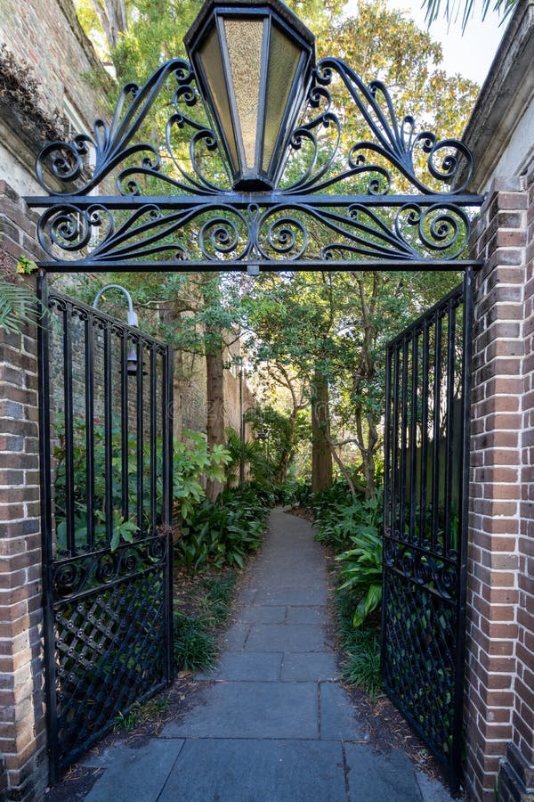 Garden gate to a pathway stock photo. Image of america - 266610138
