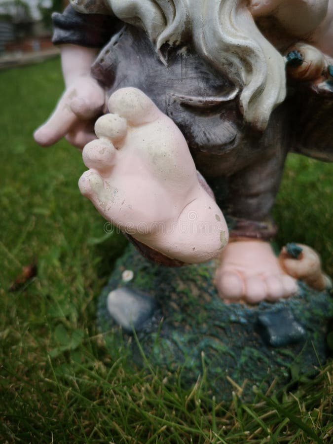 Gnome in Green Suit and Red Pointed Hat in Back Side View Stock Photo ...