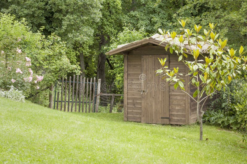 Garden hut and an old gate stock image. Image of green - 72591109