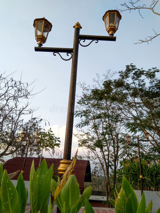 Garden Lamp Post between Trees Stock Photo - Image of antique, post ...