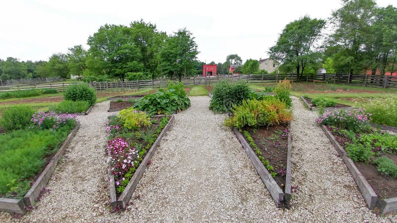 Triangular Gardens with Flowers and Herbs Stock Photo - Image of ...