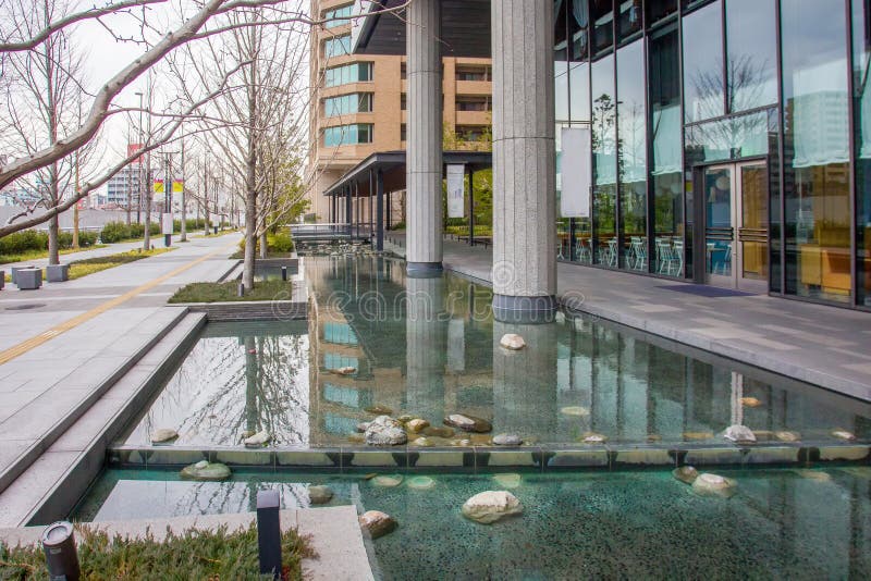 Garden Next To Front North Osaka Building with Water Next To Building ...