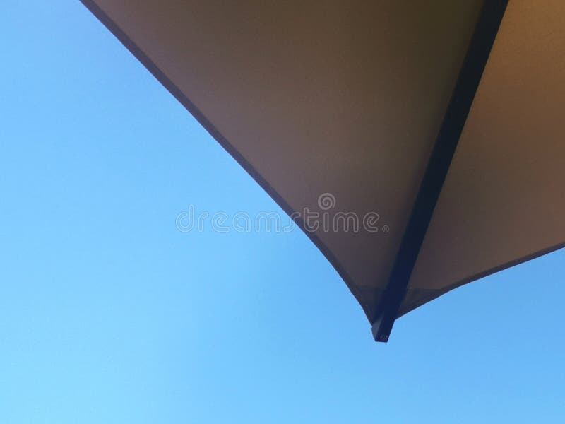 Garden Parasol Against Blue Sky with Space for Copy Stock Image - Image ...