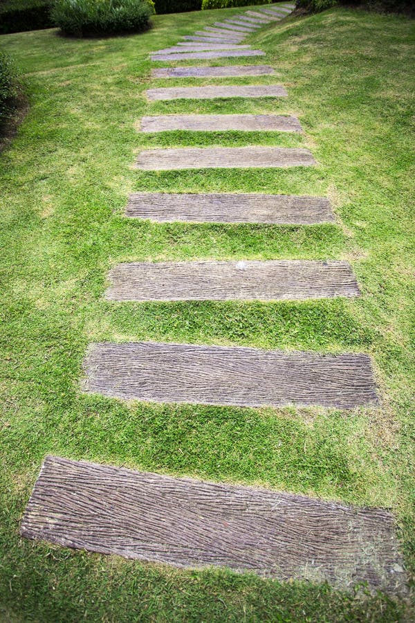Garden Path with Grass Growing Up between the Wooden Stock Image ...