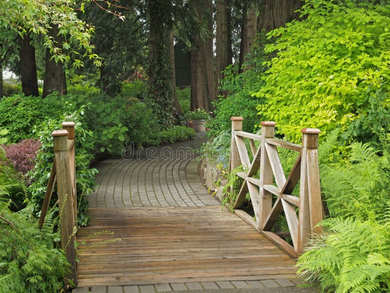 Garden pathway with bridge stock image. Image of landscaping - 25143261