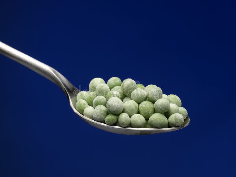 Garden pea on spoon stock photo. Image of fresh, green - 49134310