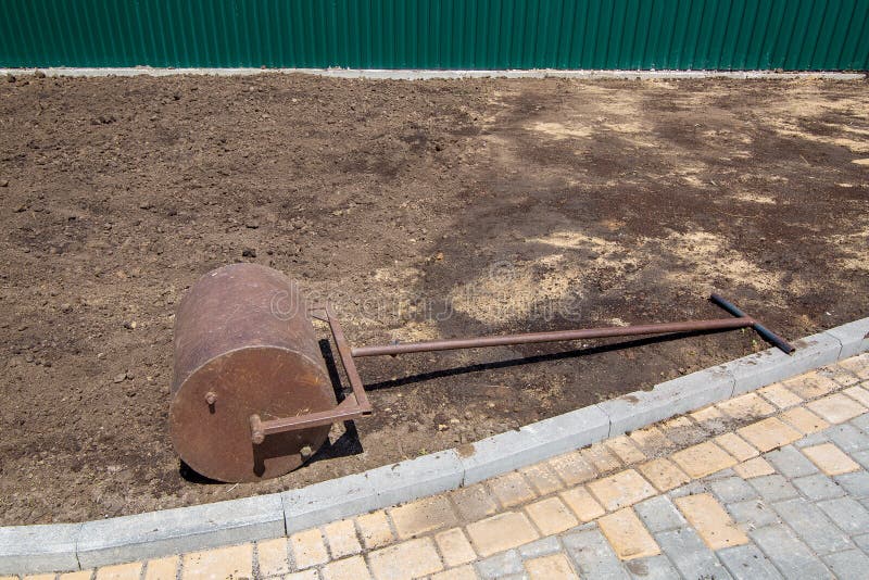 Garden Roller for Rolling Soil an Iron Tool with a Handle . Stock Photo ...