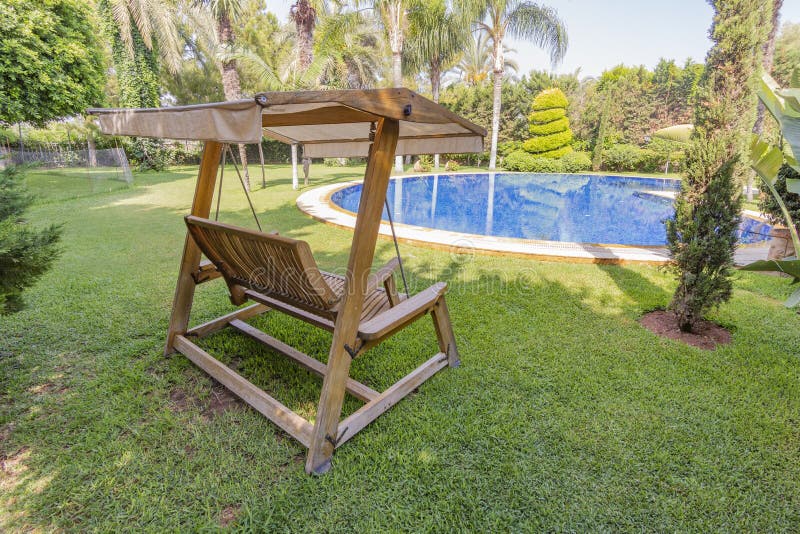 The Garden Swing by the Pool in Turkey Stock Photo - Image of house ...