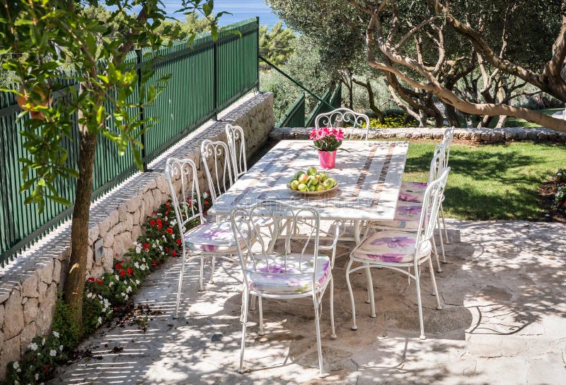 Garden table setting stock image. Image of paradise - 131303589