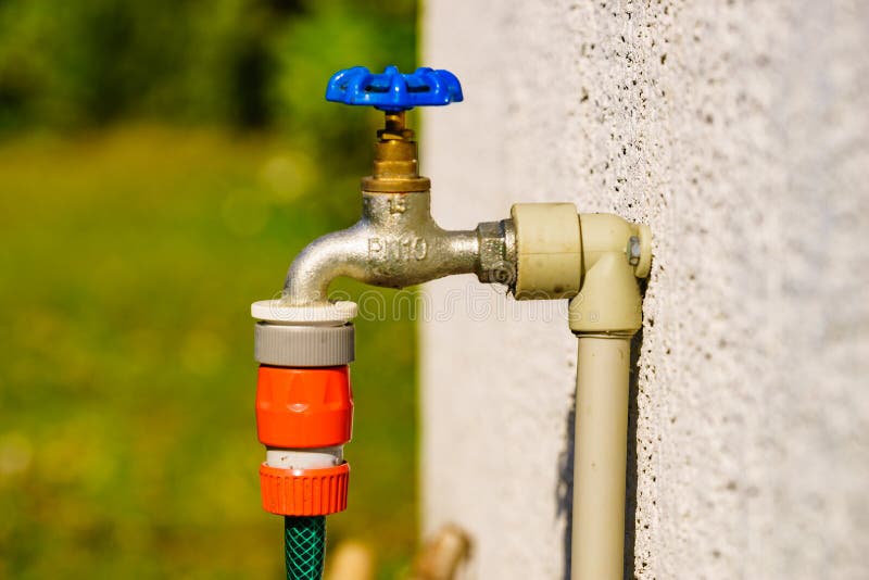 Garden Tap with Hosepipe Attached Stock Photo - Image of pipe, outdoor ...