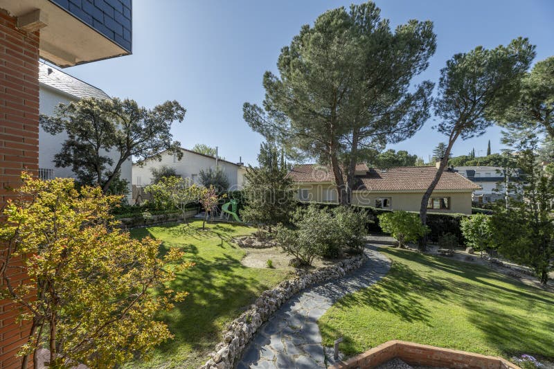 Garden with a Tiled Path and a Grassy Garden in the Background with a ...