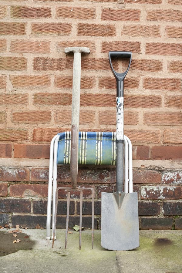 Garden tools stock image. Image of fork, spade, wall - 12729399