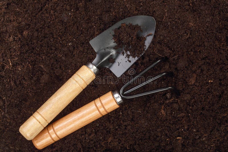 Garden Tools in Soil As a Background Closeup Stock Image - Image of ...