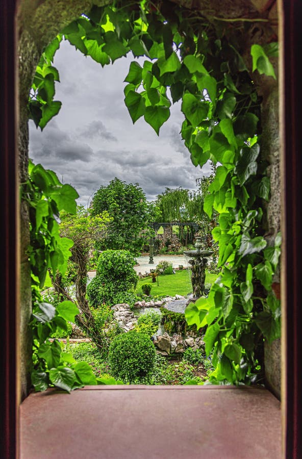 Garden View through a Stone Window. Stock Photo - Image of spain, hole ...