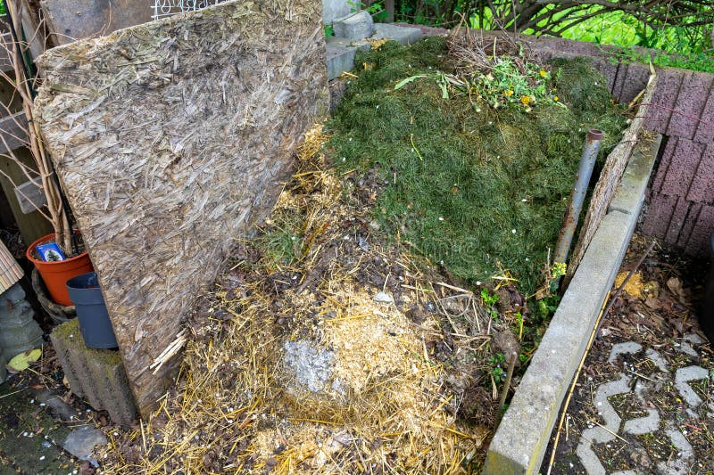 Garden Waste on a Composter in the Garden Stock Photo - Image of water ...