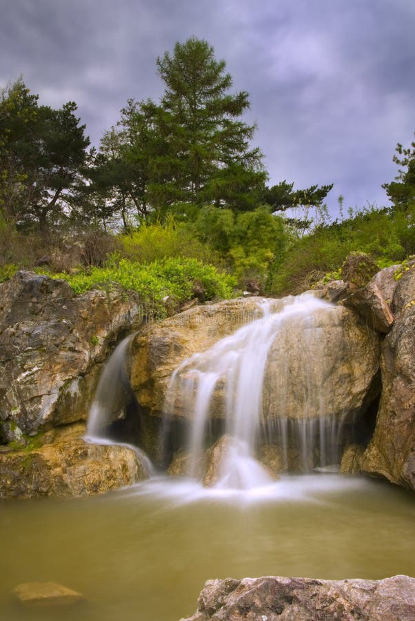 Garden waterfall stock photo. Image of cloudy, spring - 5200258