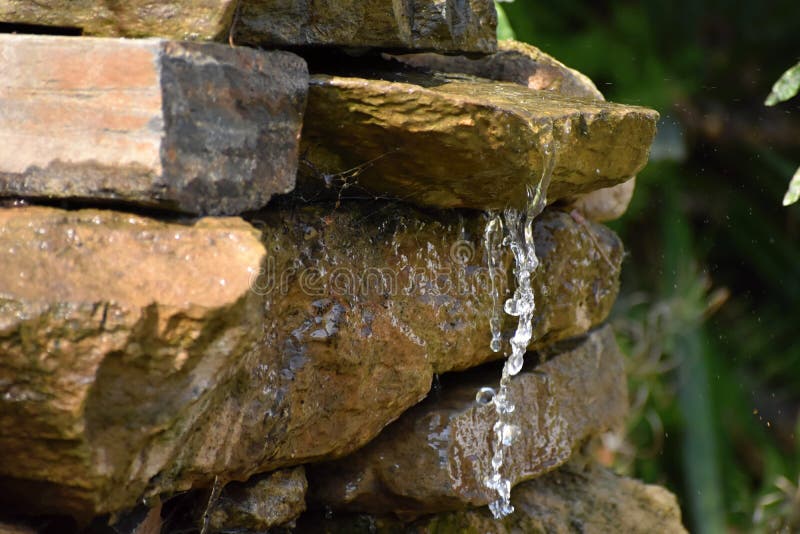 Garden Waterfall of Stones. Water Flows through the Stone. the Morning ...