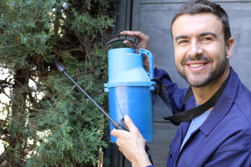 Gardener in Blue Uniform Holding Fumigation Equipment Stock Image ...