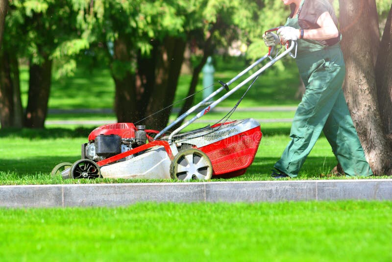 Lawn Mower with Gardener. Grass Cutting. Aerial from Drone. Stock Photo ...