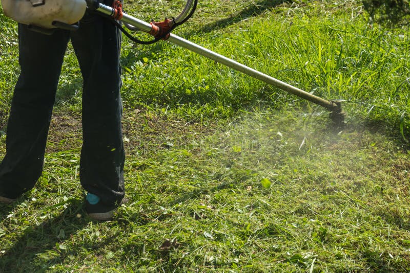 The Gardener Cutting Grass by Lawn Mower Editorial Stock Photo - Image ...