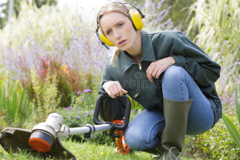 Gardener Cutting Grass with Machine at Plantation Stock Image - Image ...