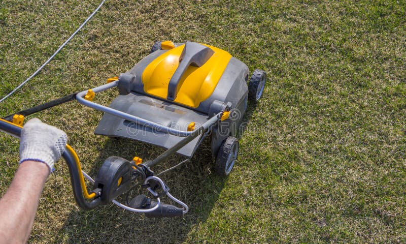 Gardener Operating Soil Aeration Machine on Grass Lawn Stock Photo ...