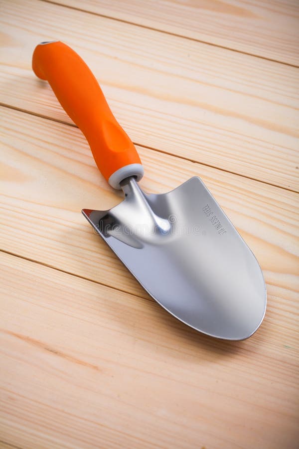 Gardening Hand Tools - Trowel and Fork on Wooden Boards Stock Photo ...