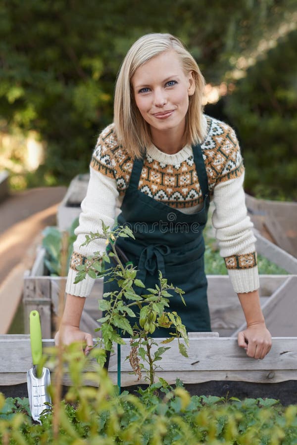 Gardening is My Passion. a Beautiful Young Woman Gardening Outside ... Gardening is My Passion. a Beautiful Young Woman Gardening Outside ...