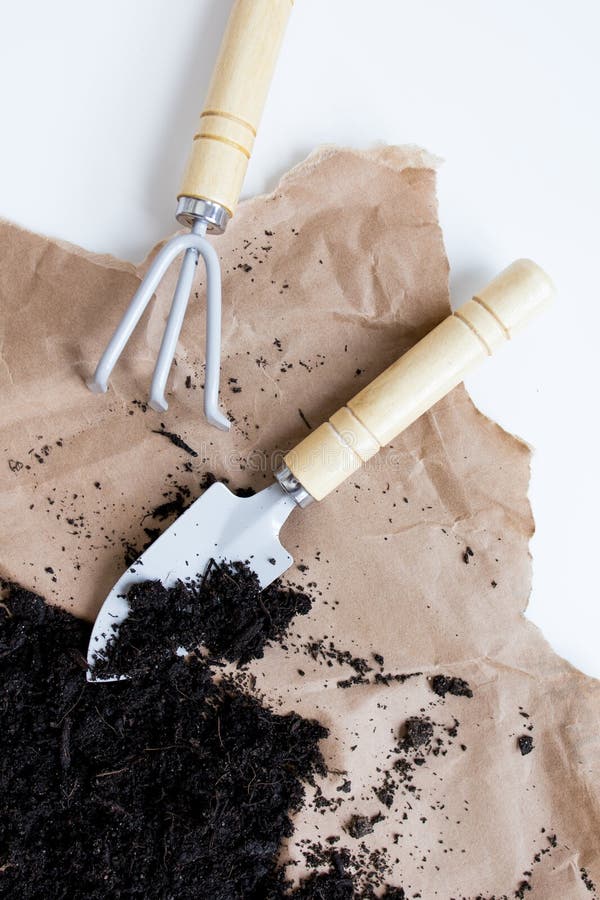 Gardening Tools on Brown Paper with Fresh Soil for Horticulture and ...